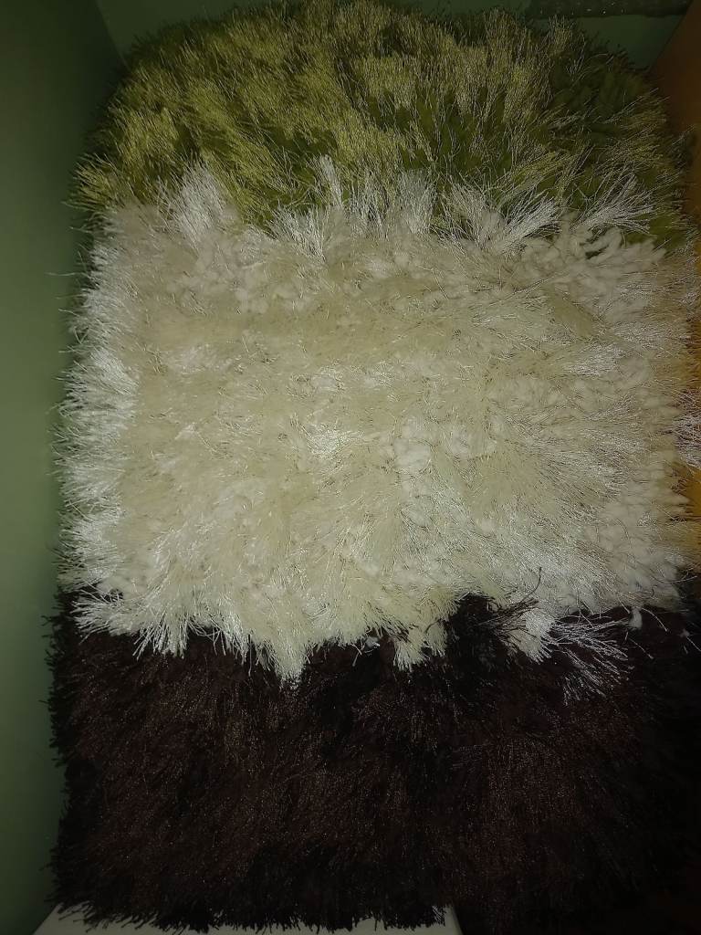 Piano/dressing table stool with storage and thick fluffy rug covering ...