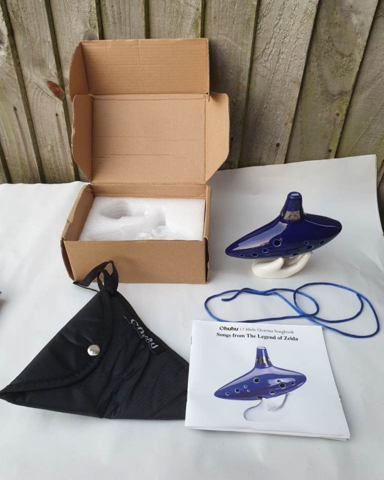 An Ohuhu 12 hole Ocarina with carry case, 'hand' stand & Songs from the ...